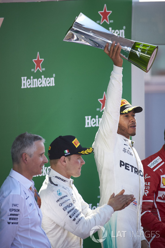 Second place Valtteri Bottas, Mercedes AMG F1, applauds as Race winner ...