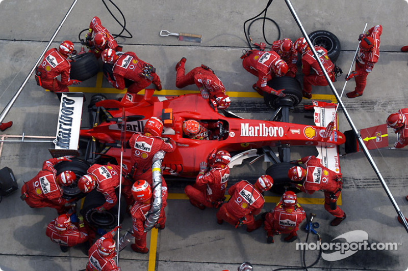 Ferrari pit crew waits for Michael Schumacher at Malaysian GP